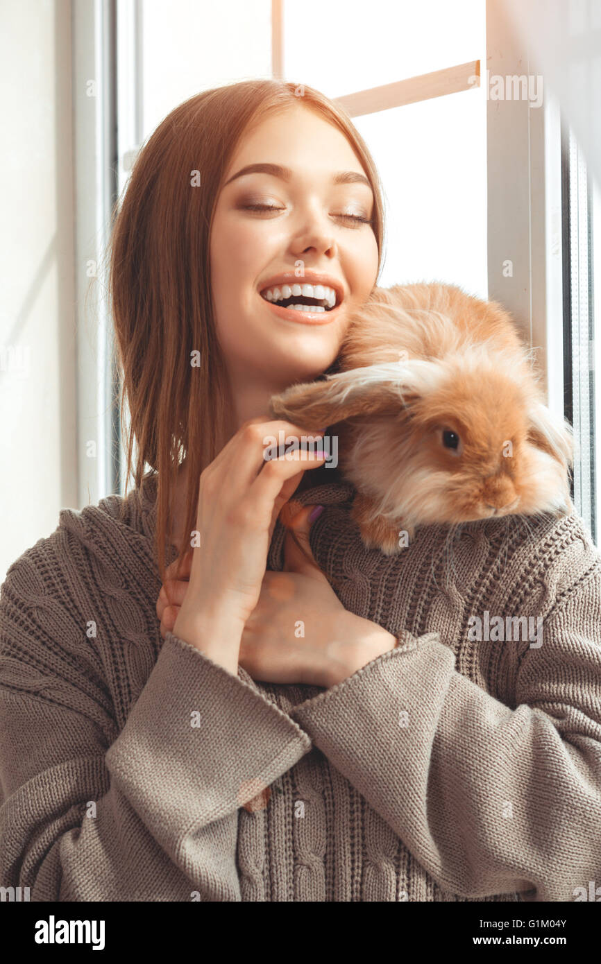 Beautiful Young Woman With Rabbit Stock Photo - Alamy