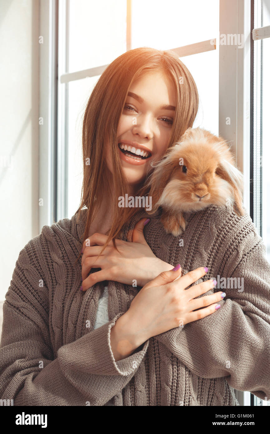Beautiful Young Woman With Rabbit Stock Photo - Alamy