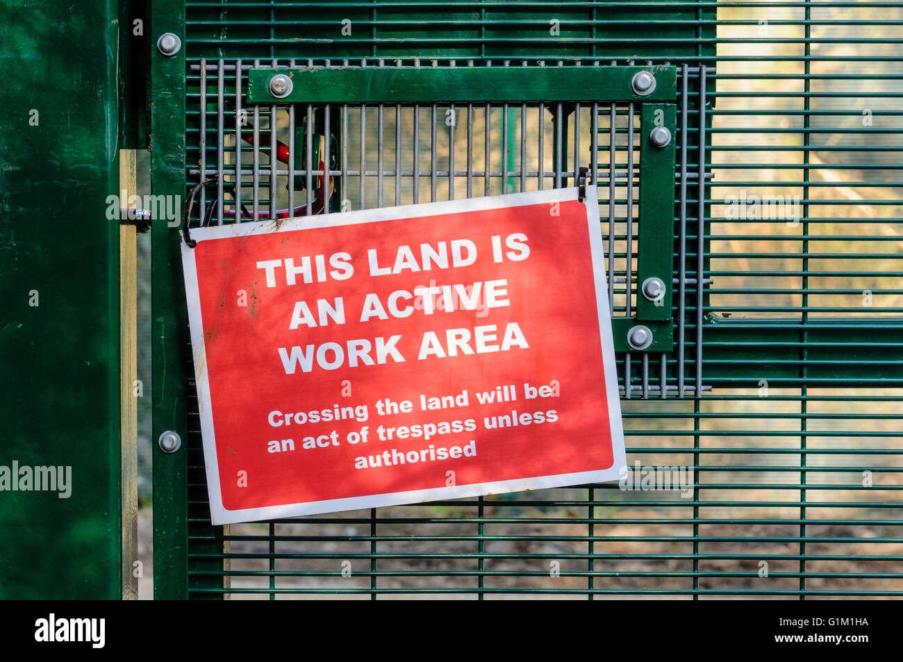 Security sign on a fence at a secure work site Stock Photo - Alamy