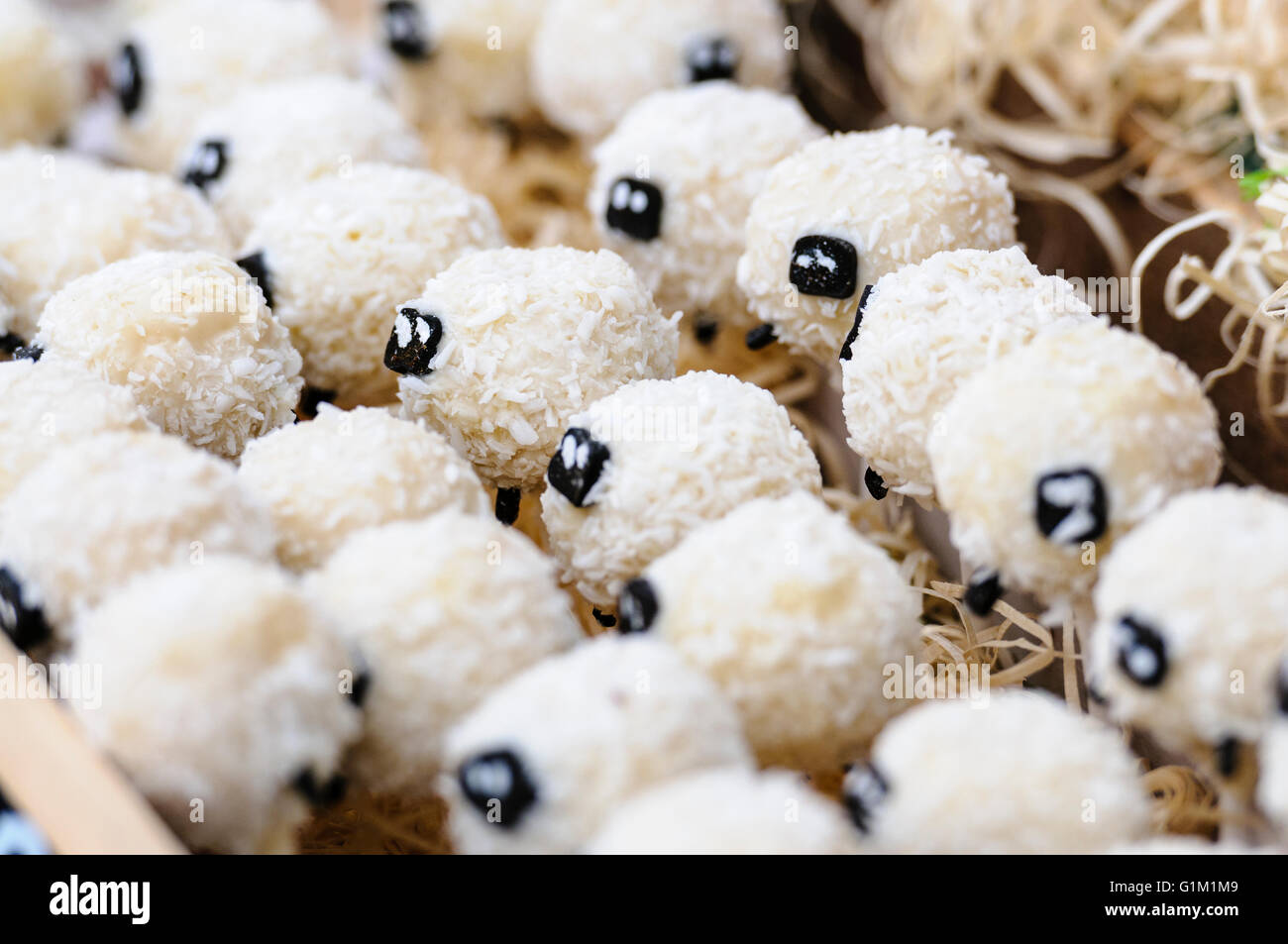 Sheep shaped coconut balls on sale at a market stall shop Stock Photo ...
