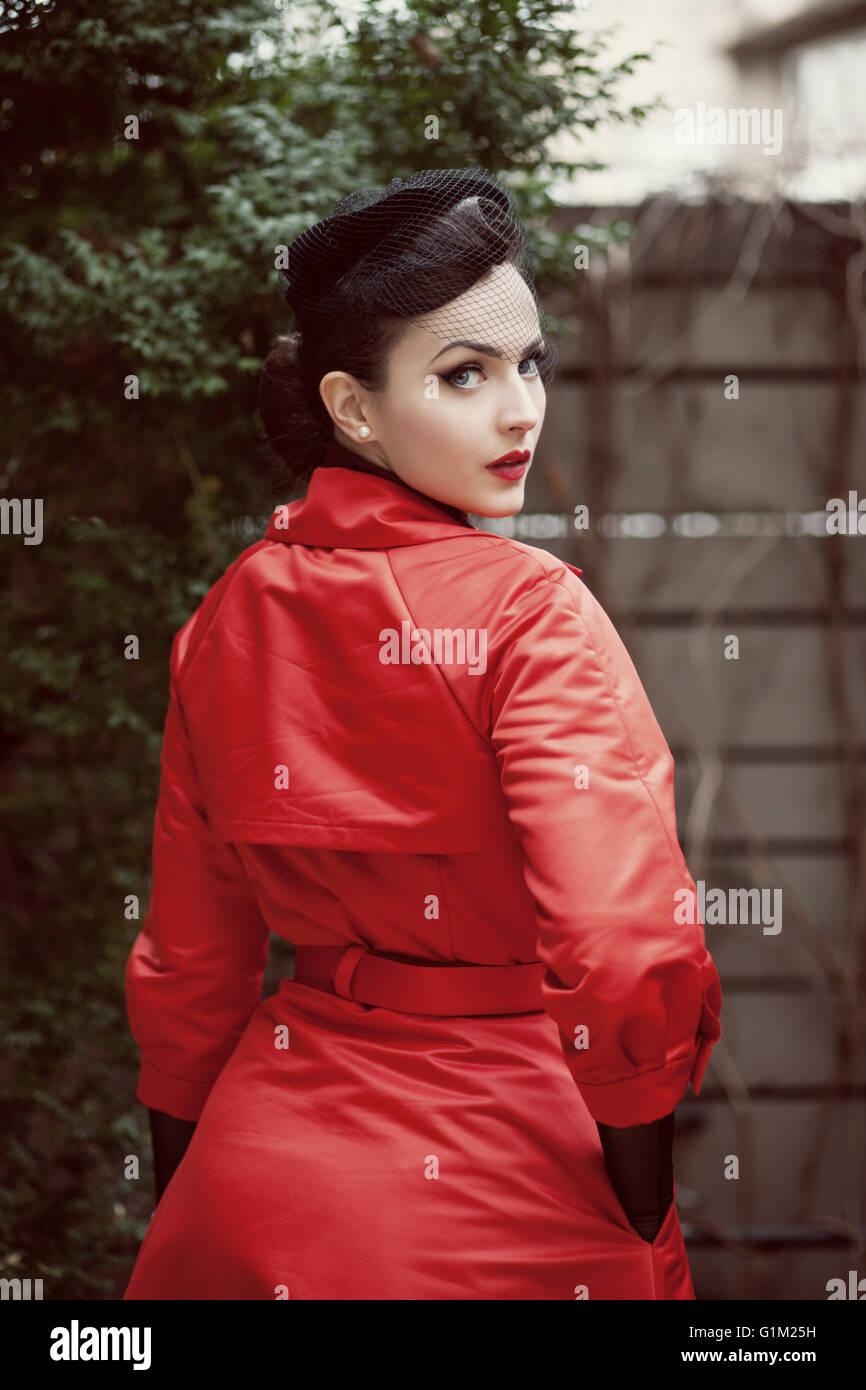 Woman in red coat hi-res stock photography and images - Alamy