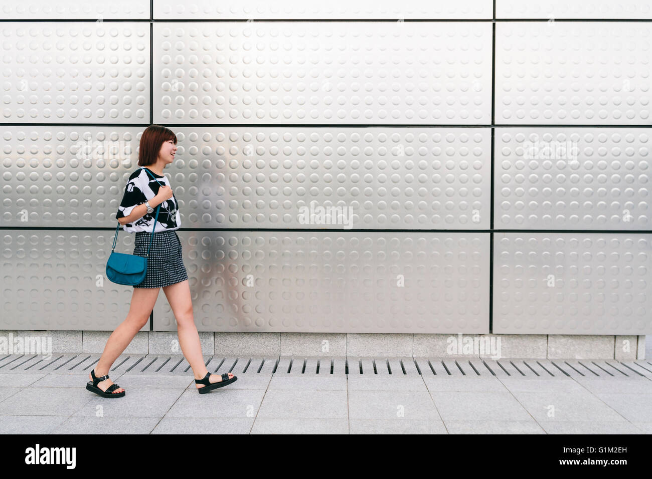 Chinese woman walking hi-res stock photography and images - Alamy