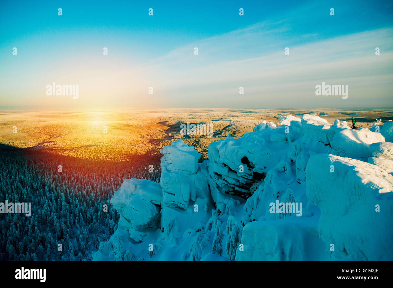 Snowy hilltop overlooking remote landscape Stock Photo - Alamy