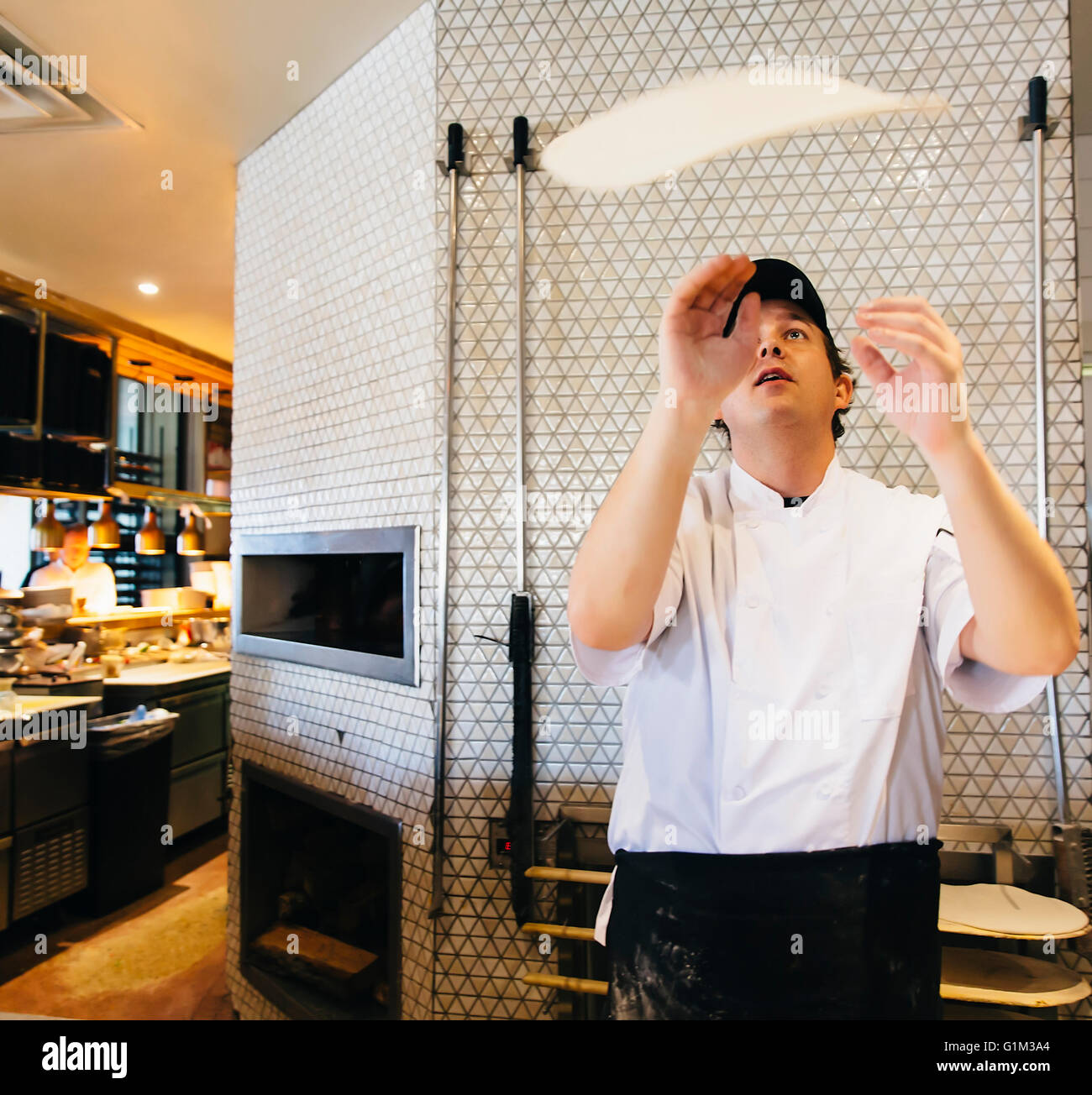 Tossing pizza dough hi-res stock photography and images - Alamy