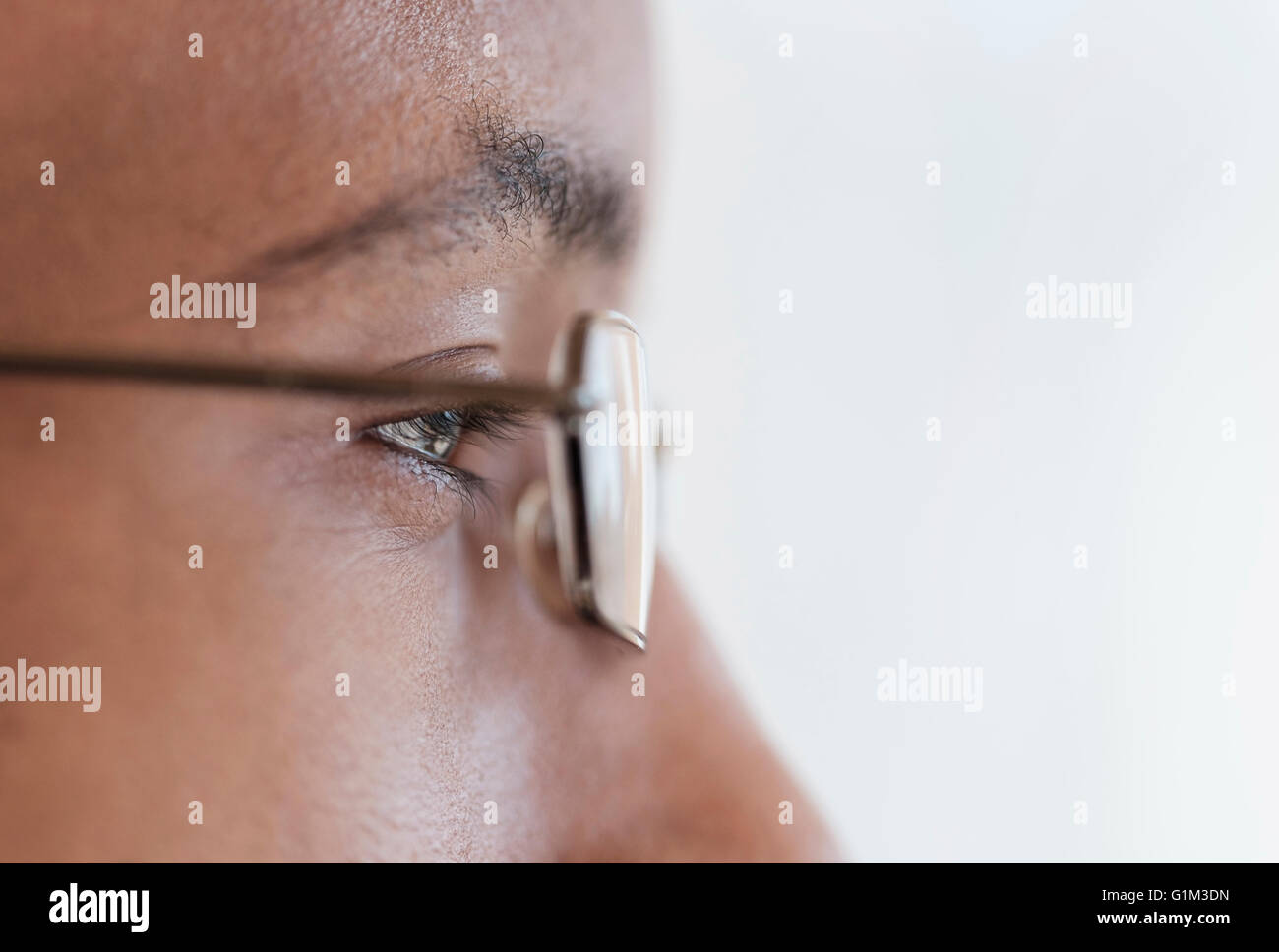 Close up profile of eyes and eyeglasses of Black man Stock Photo - Alamy