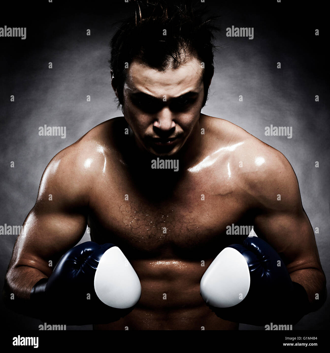 Caucasian boxer flexing his muscles Stock Photo - Alamy