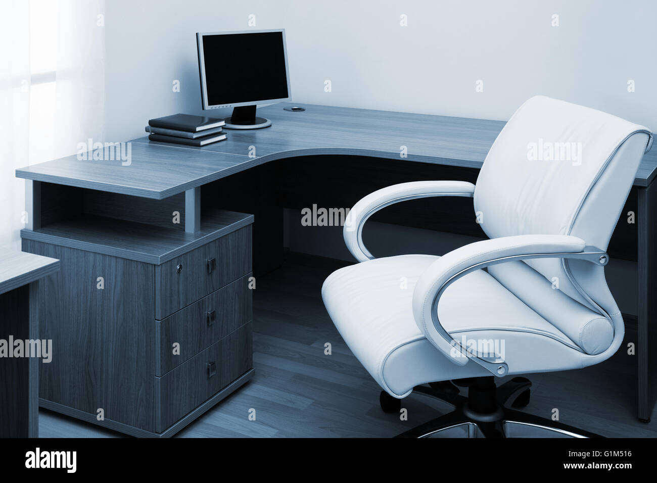 The monitor on a table at modern office Stock Photo - Alamy