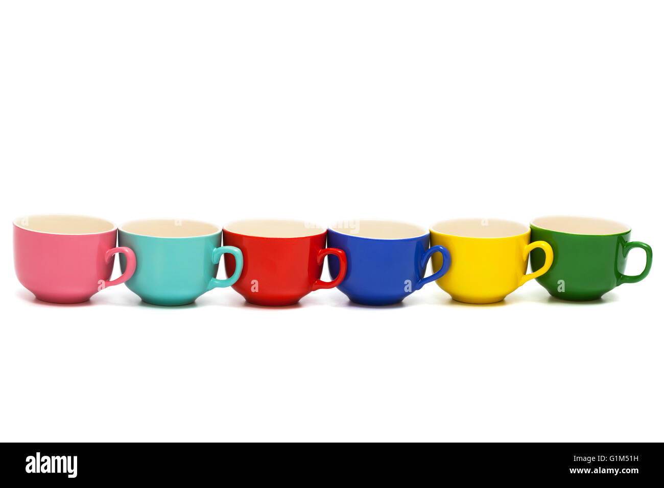 Beautiful color cups on a white background Stock Photo - Alamy