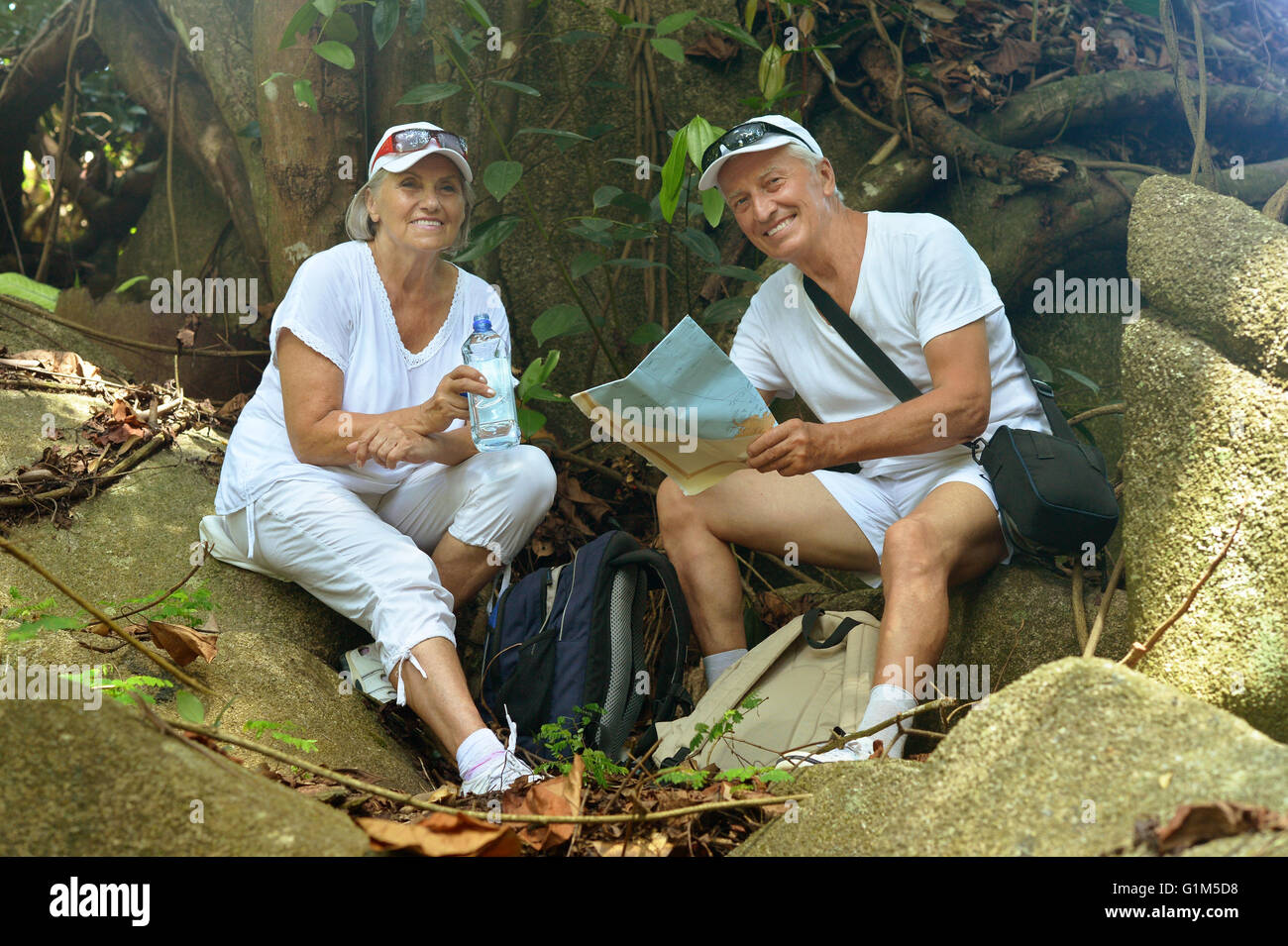 elderly couple rest at tropical resort Stock Photo - Alamy
