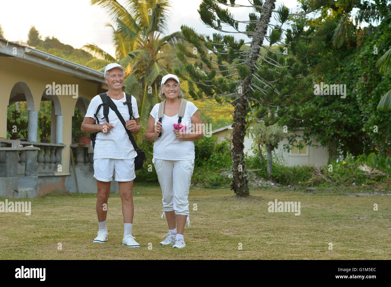elderly couple rest at tropical resort Stock Photo - Alamy