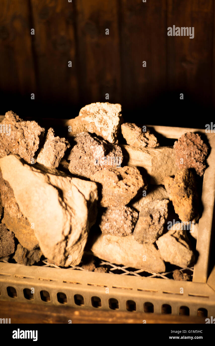 Wood sauna heated rocks heater photo Stock Photo - Alamy