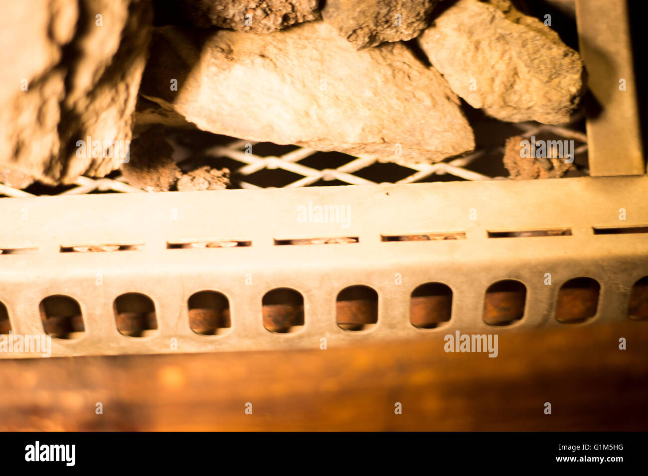 Wood sauna heated rocks heater photo Stock Photo - Alamy