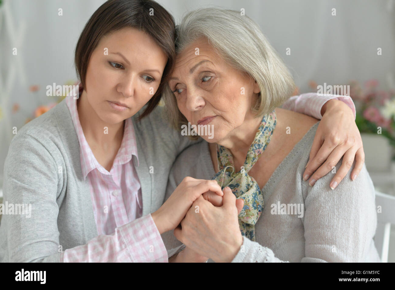 miserable mother and adult daughter Stock Photo - Alamy