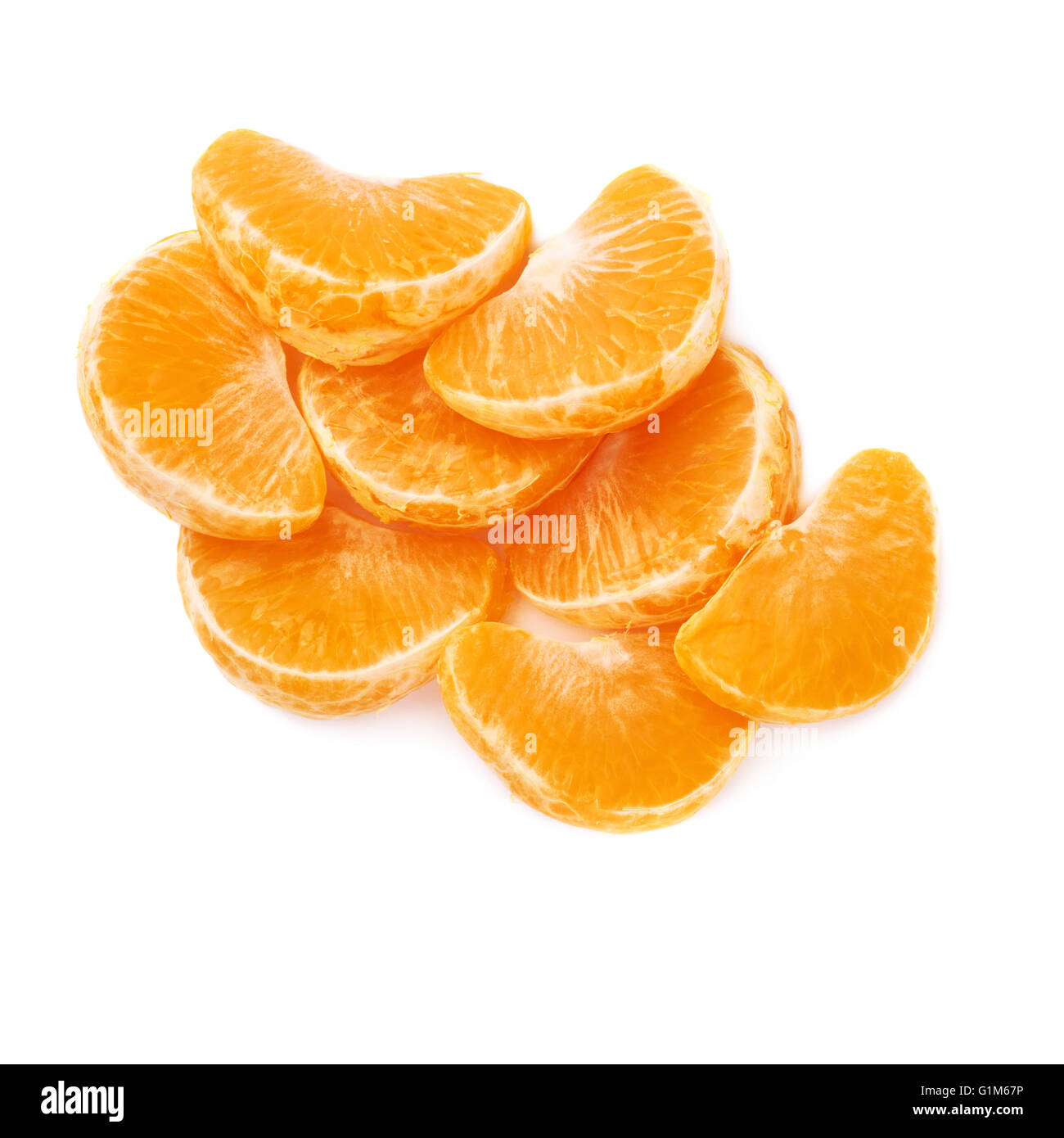 Pile of slice sections of tangerine isolated over the white background ...