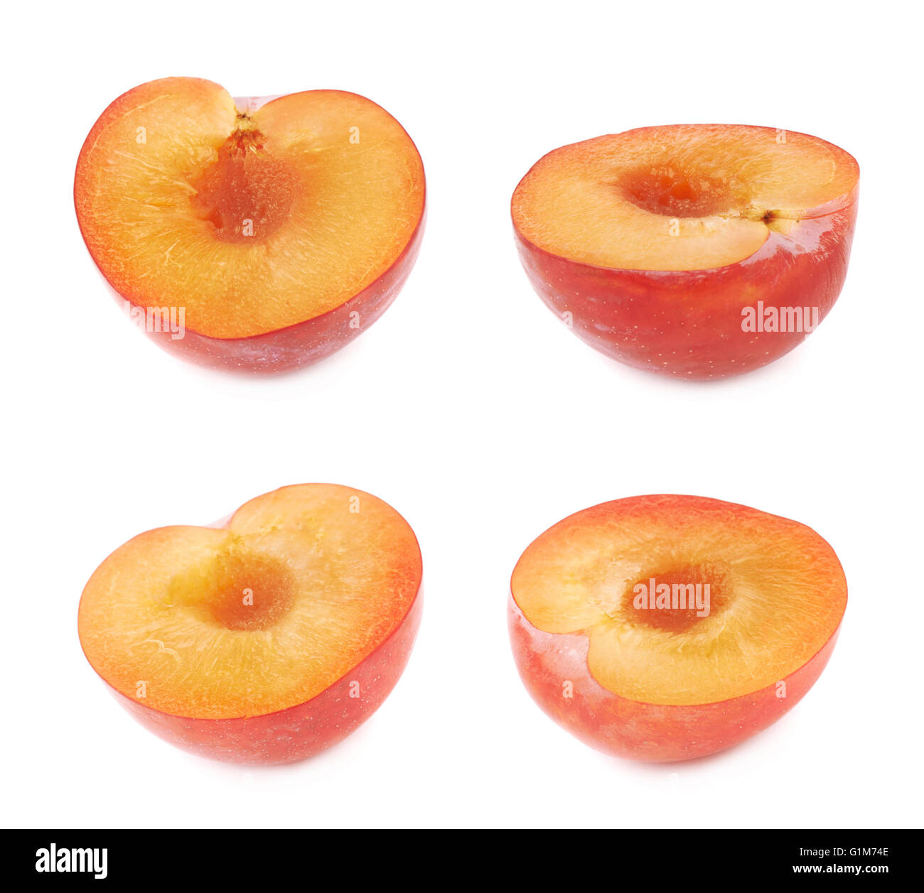 Cut open plum half isolated Cut Out Stock Images & Pictures - Alamy
