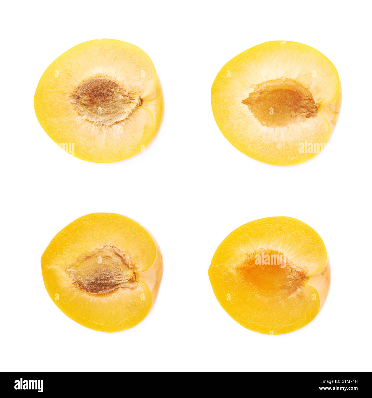 Cut open plum half isolated Cut Out Stock Images & Pictures - Alamy