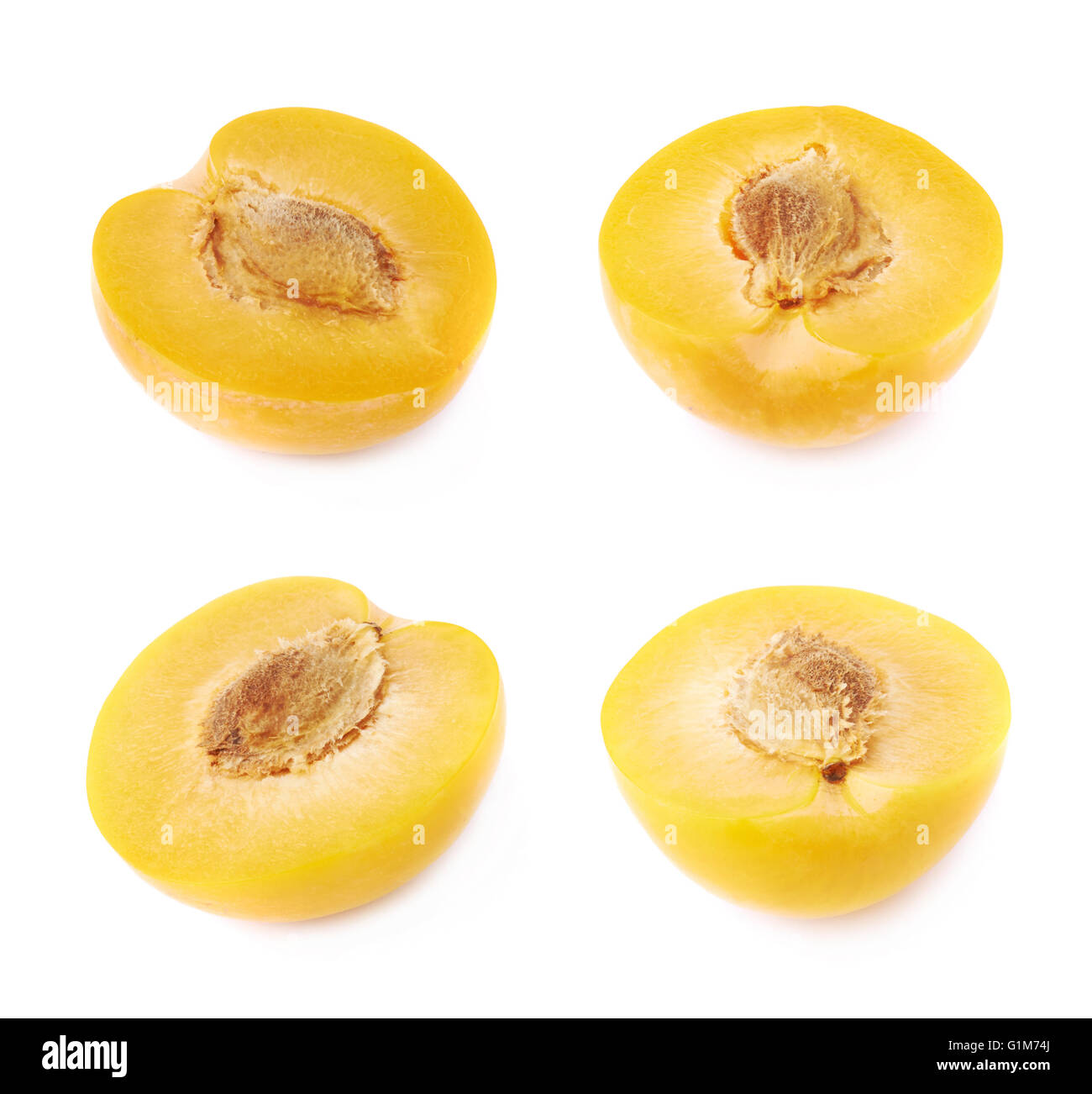 Cut open plum half isolated Cut Out Stock Images & Pictures - Alamy