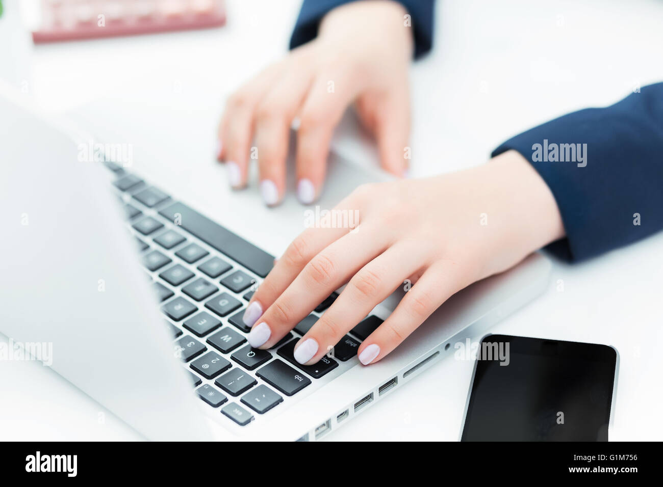 The female hands on the keyboard of her laptop computer Stock Photo - Alamy