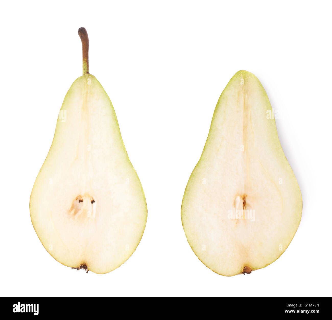 Green pear cut in half isolated Stock Photo - Alamy