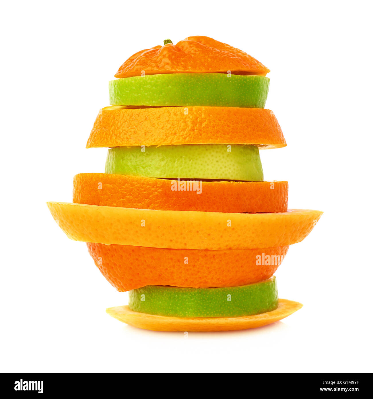 Stack of citrus sliced fruits over white isolated background Stock ...