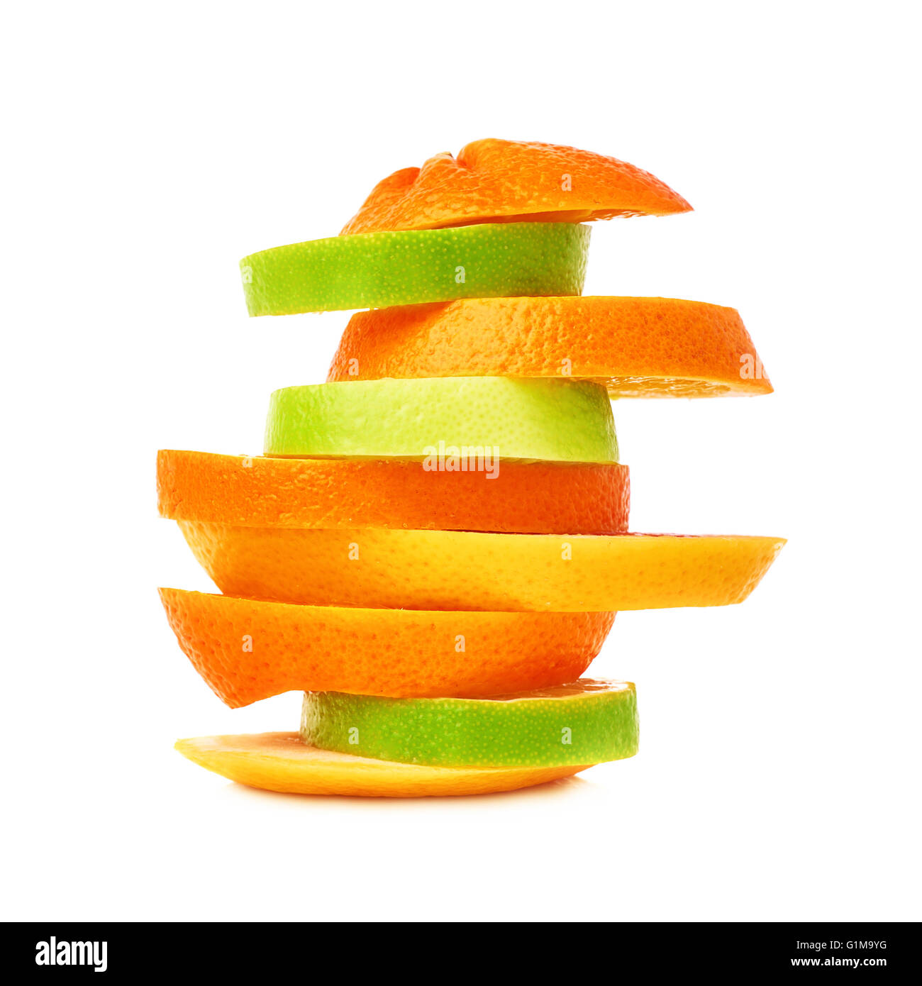 Stack of citrus sliced fruits over white isolated background Stock ...