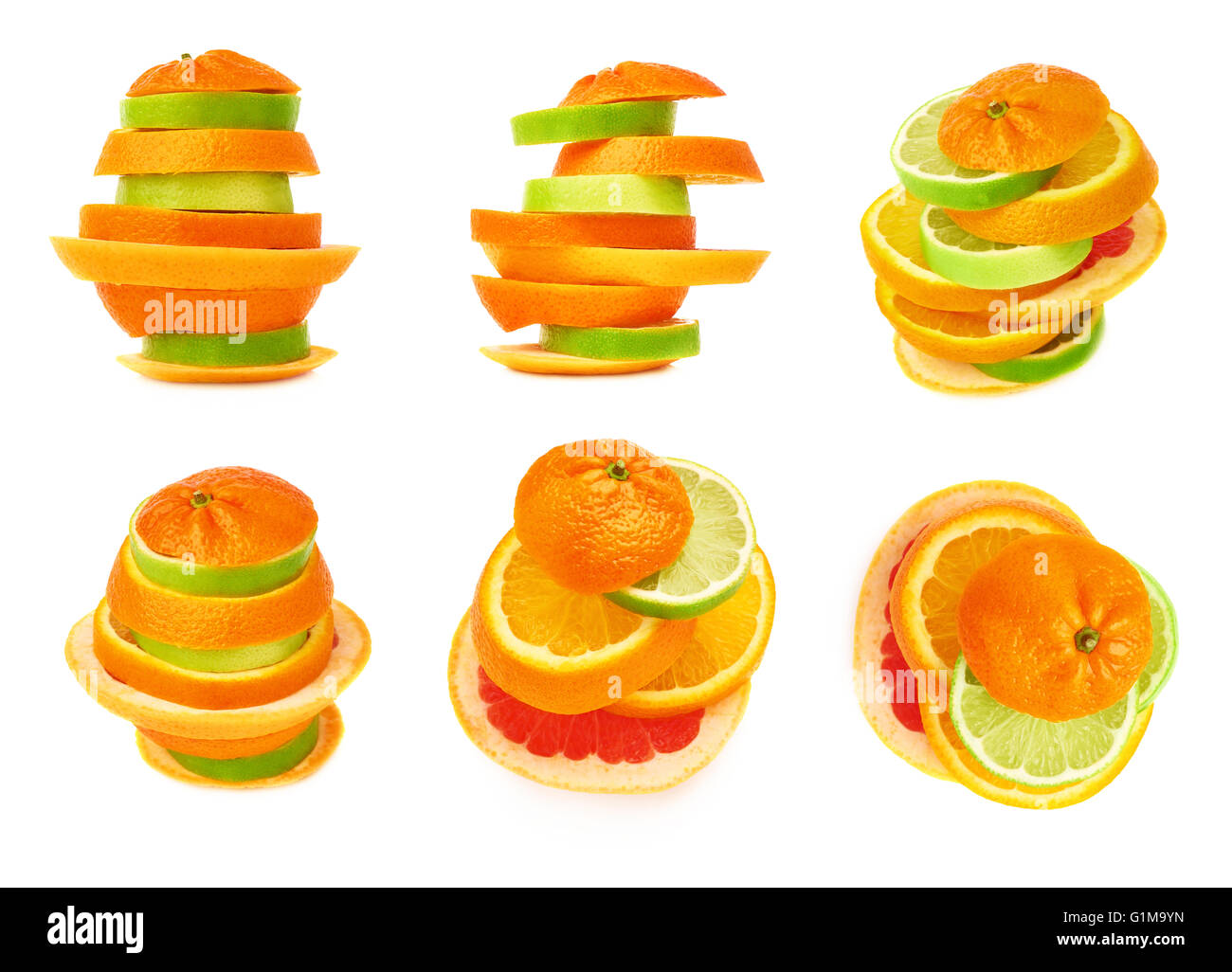 Stack of citrus sliced fruits over white isolated background Stock ...