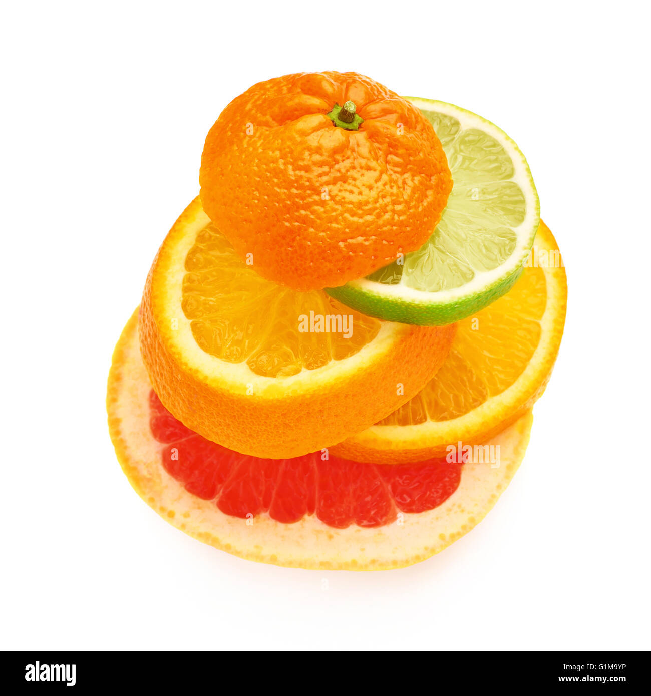 Stack of citrus sliced fruits over white isolated background Stock ...