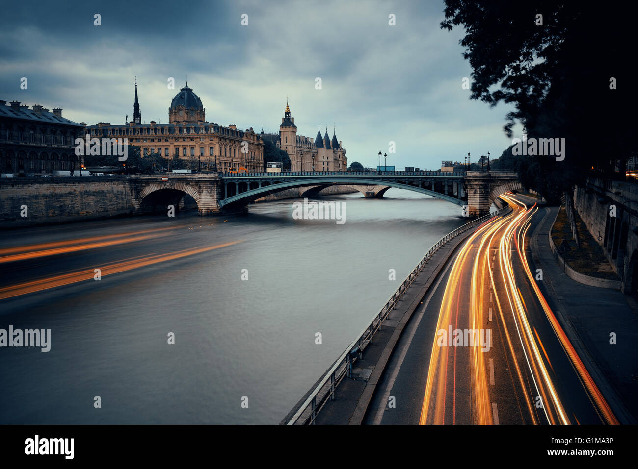 River Seine with bridge and traffic light trail Stock Photo - Alamy