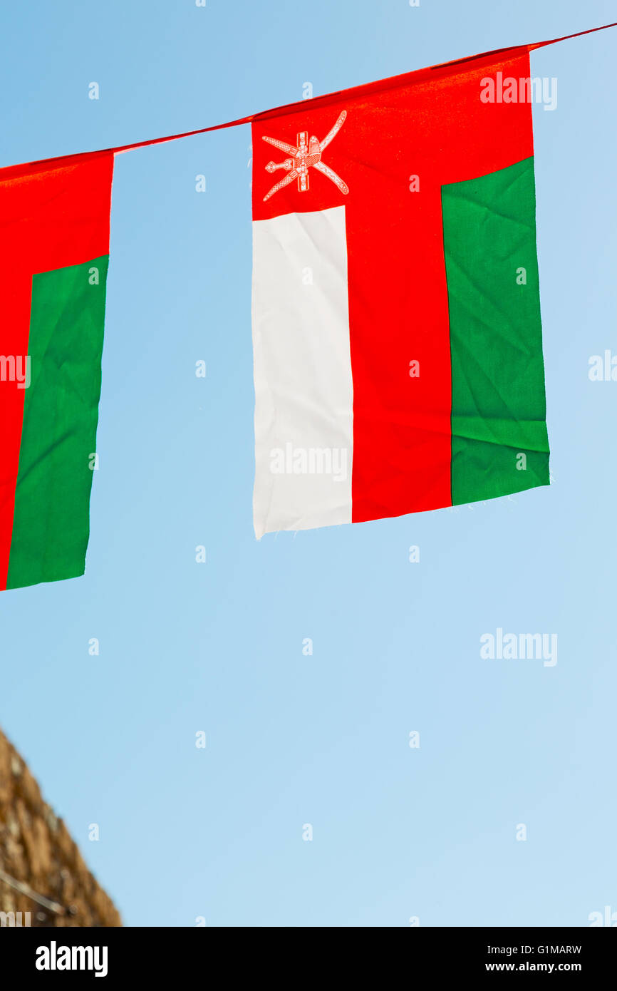 and the cloudy sky in oman waving flag Stock Photo - Alamy