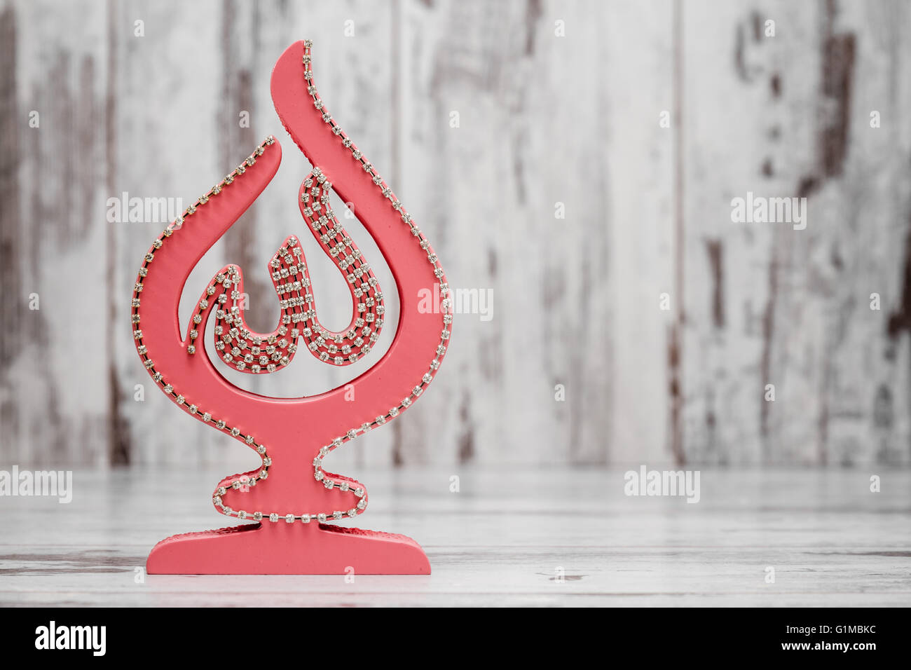 Pink Religious statuette with the name of Allah, the God written on it ...