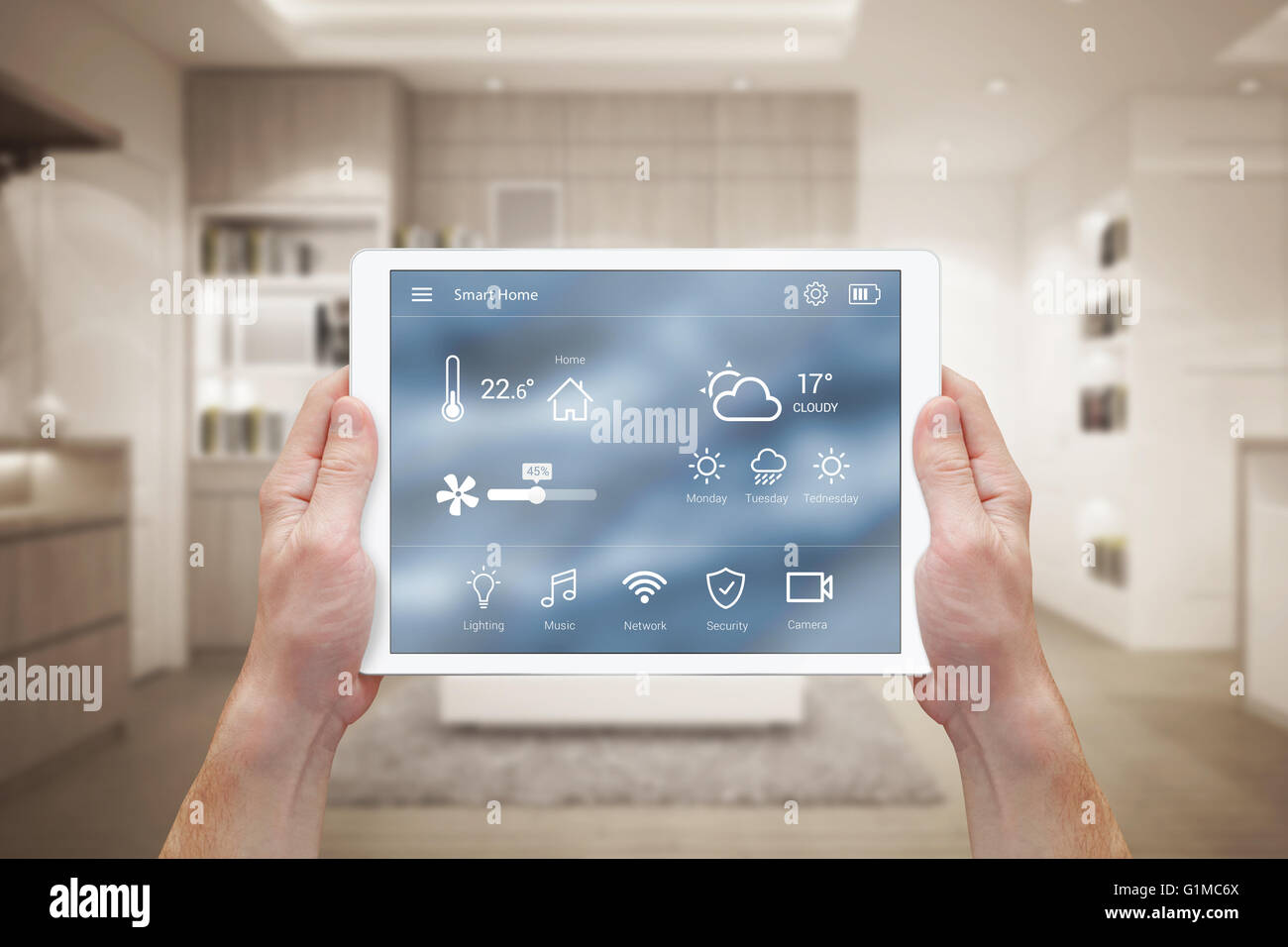 Smart home control on tablet. Interior of living room in the background ...