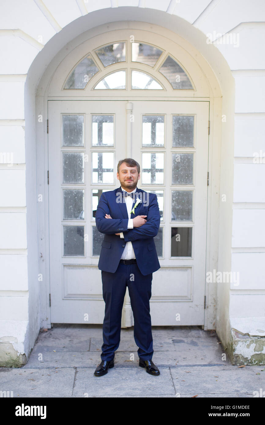 Unshaven groom in a blue suit Stock Photo - Alamy