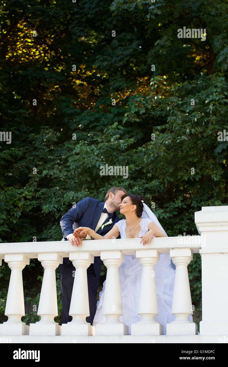 Groom in white shirt kissing bride hand. Very gentle photo Stock Photo ...