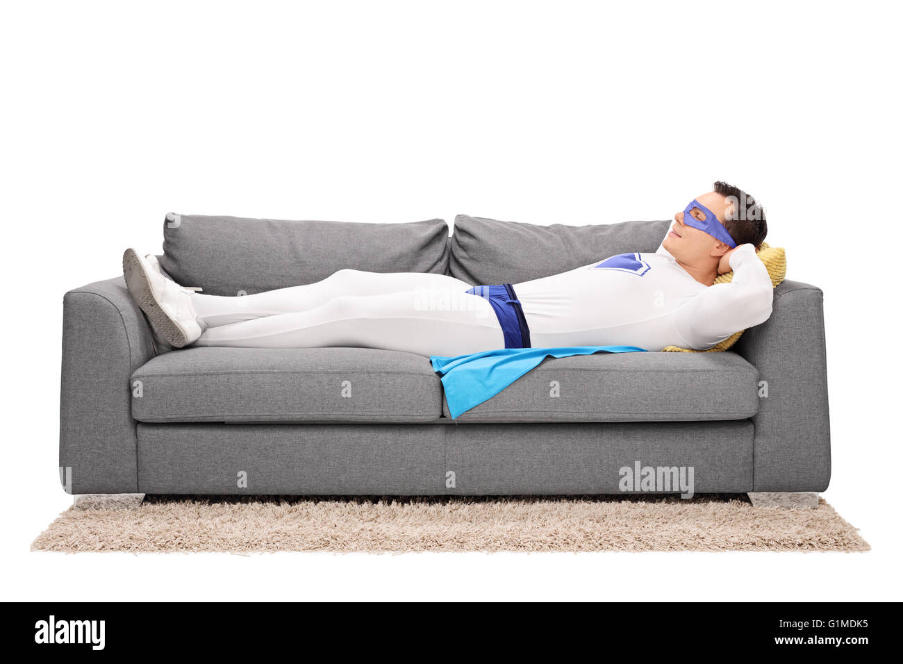 Young superhero sleeping on a couch isolated on white background Stock ...