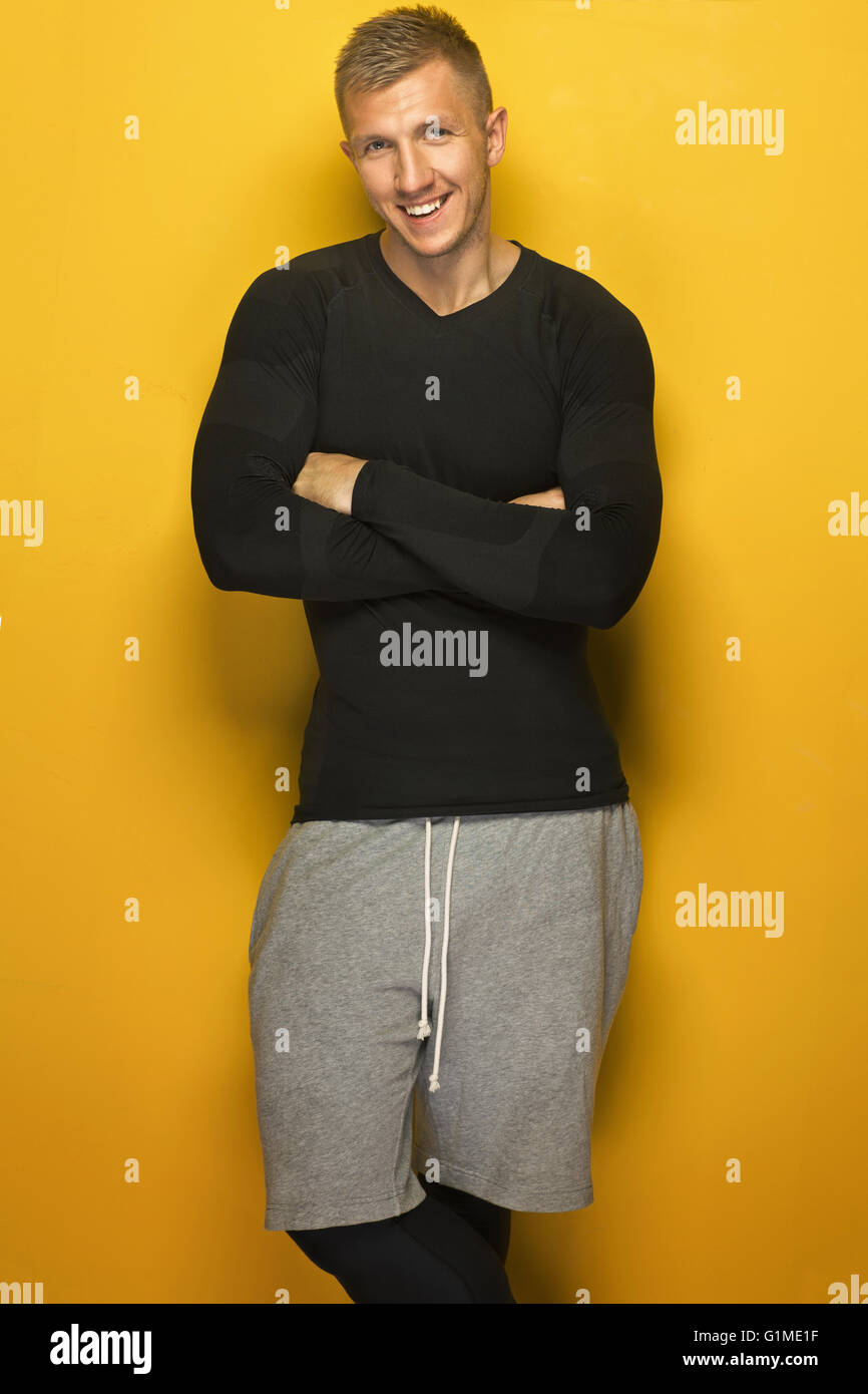 Portrait of a smiling trainer Stock Photo - Alamy