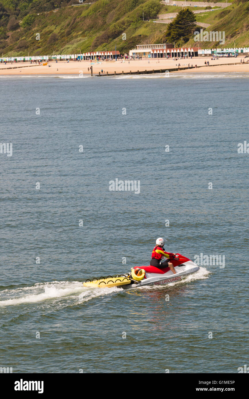 RNLI Lifeguards jetski with lifeguard at sea at Bournemouth beach ...