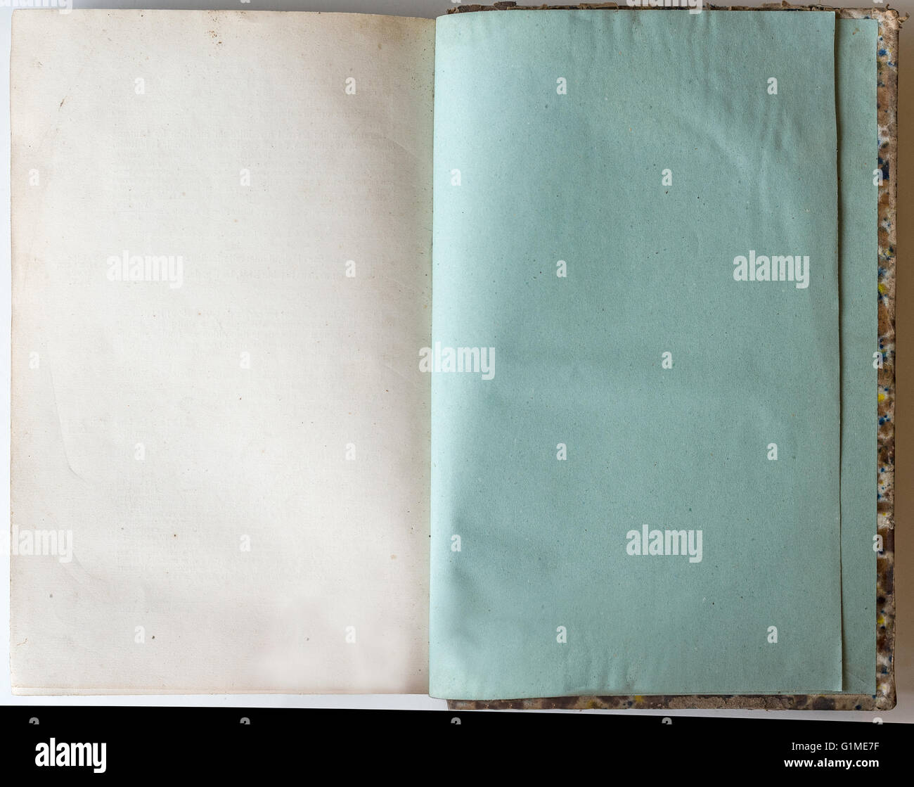 Old grunge book opened to the last page showing green aged textured ...