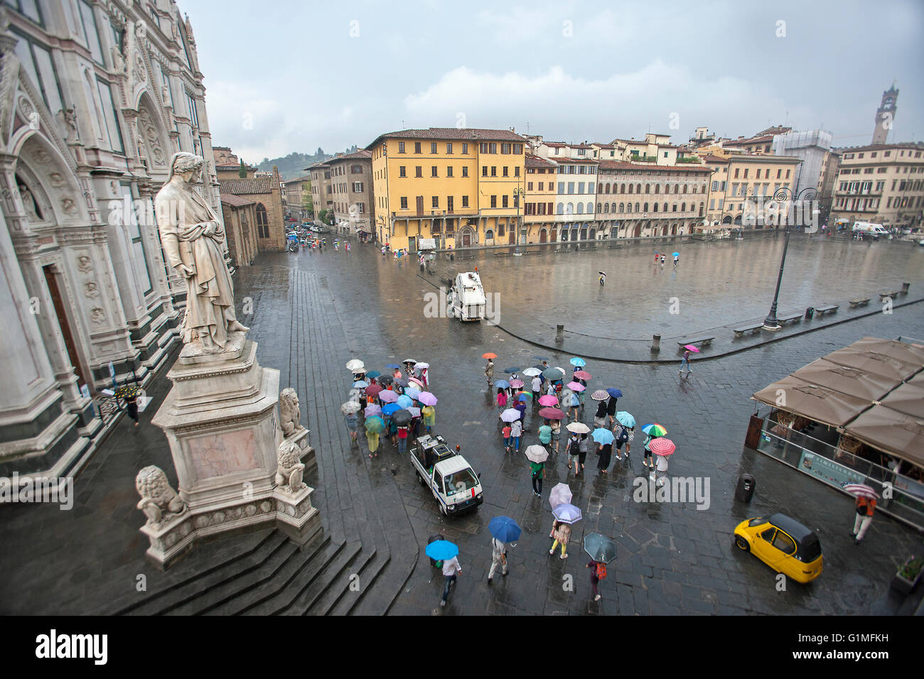 Basilica di Santa Croce with Dante statue in Florence, Italy rain and ...