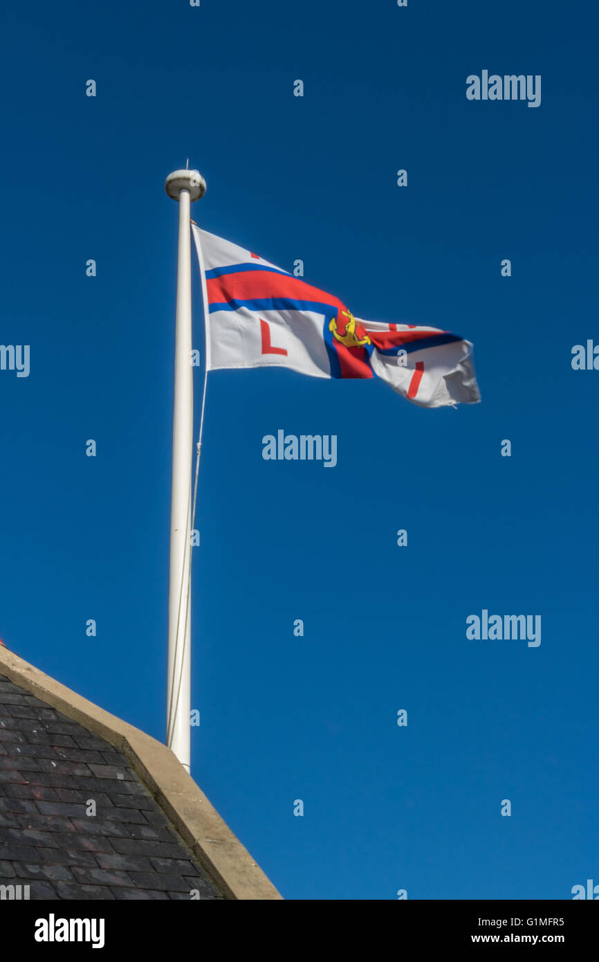 England Dorset Poole RNLI flag on Poole quay Stock Photo - Alamy