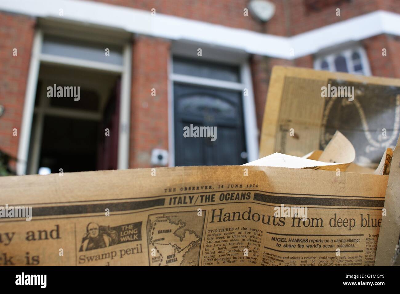 Old newspaper of 1974, about Italy and the Oceans cut out, in front of ...