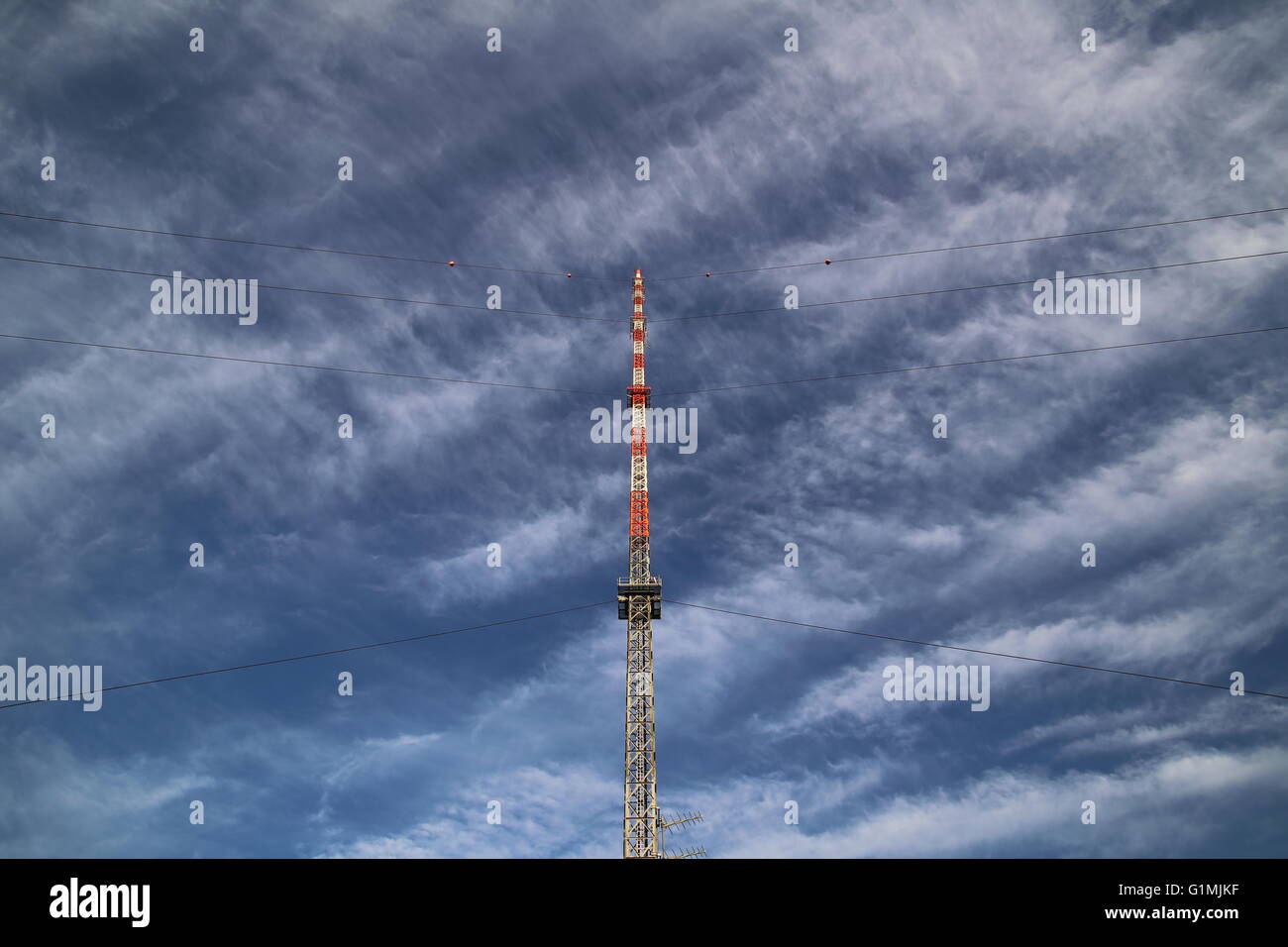 Red and white radio tower in unusual angle Stock Photo - Alamy
