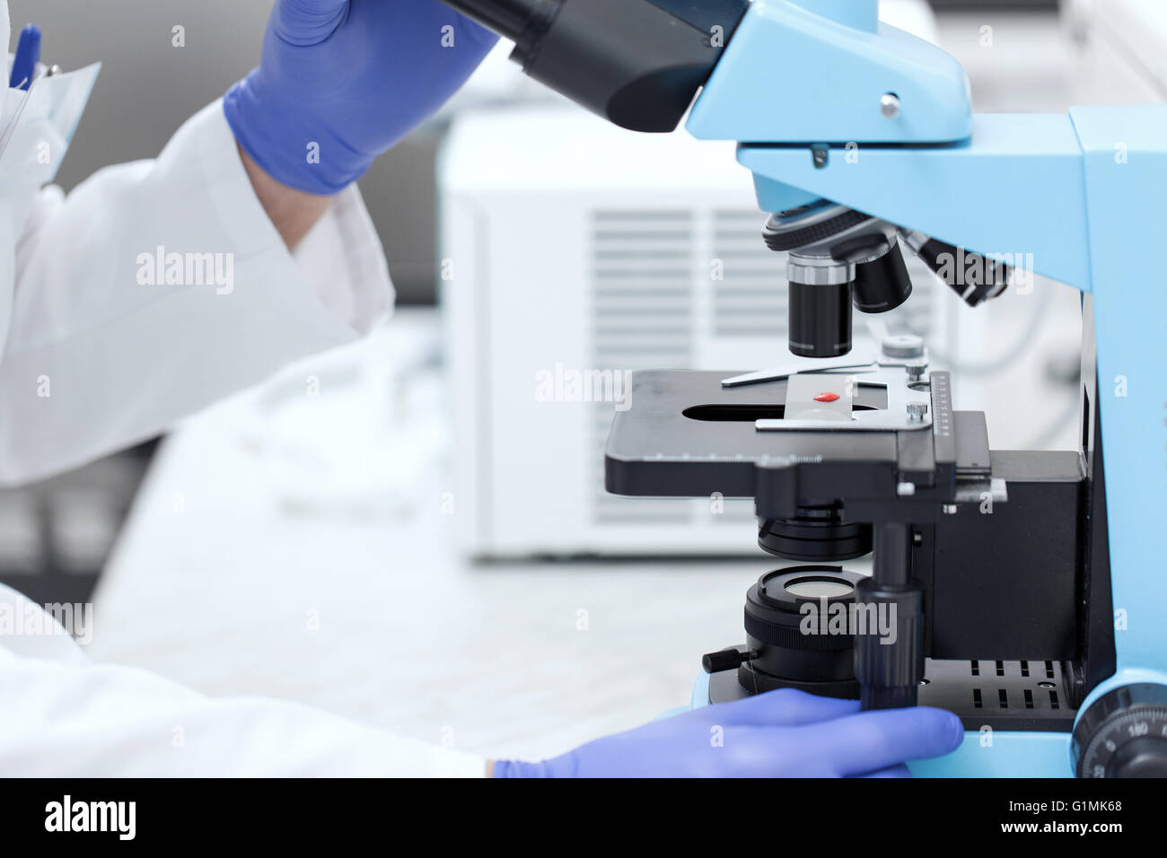 close up of hands with microscope and blood sample Stock Photo - Alamy