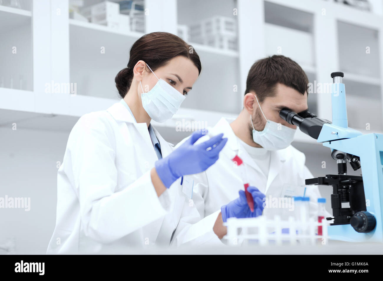 young scientists making test or research in lab Stock Photo - Alamy