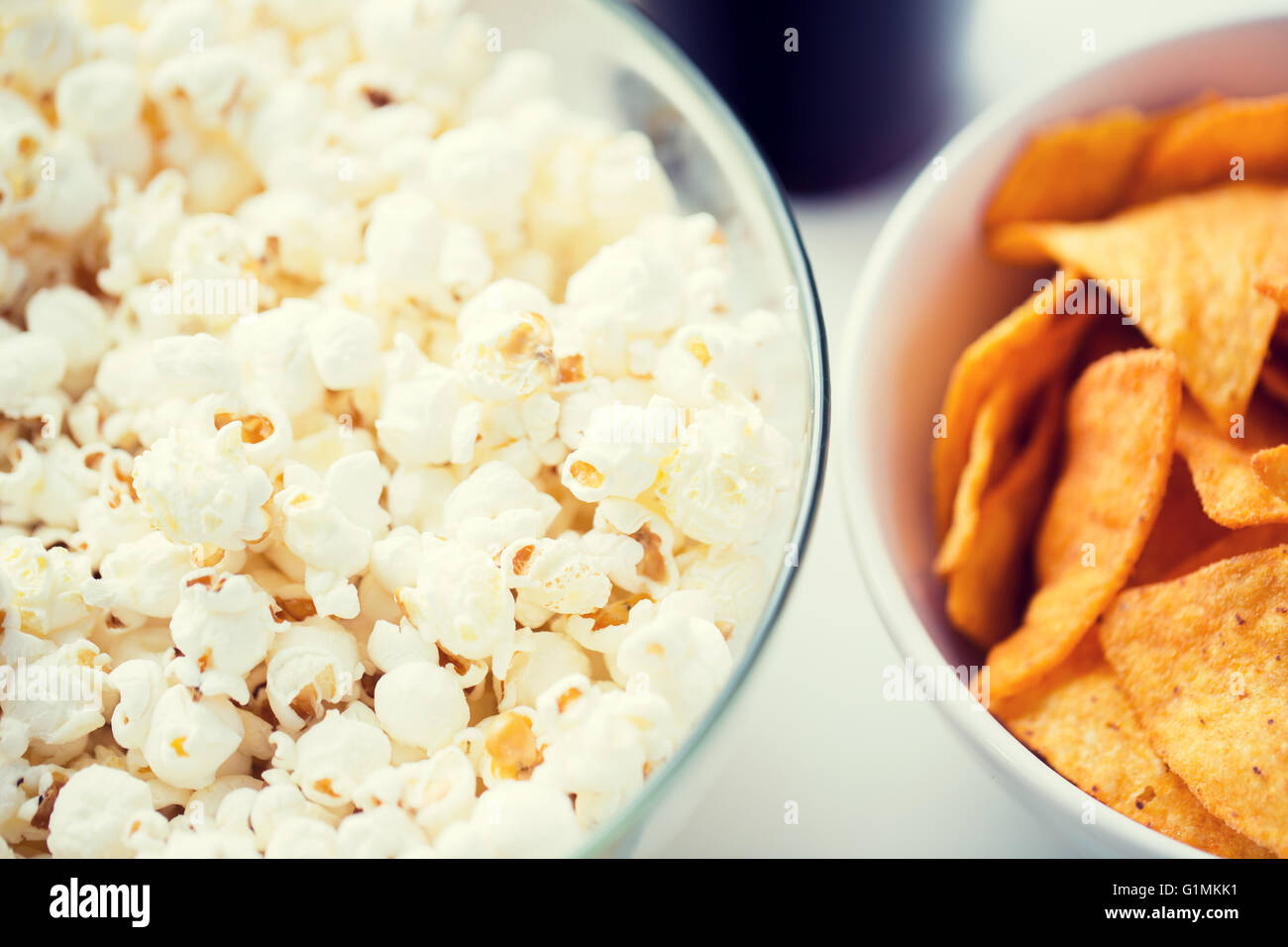 close up of popcorn and corn crisps or nachos Stock Photo - Alamy
