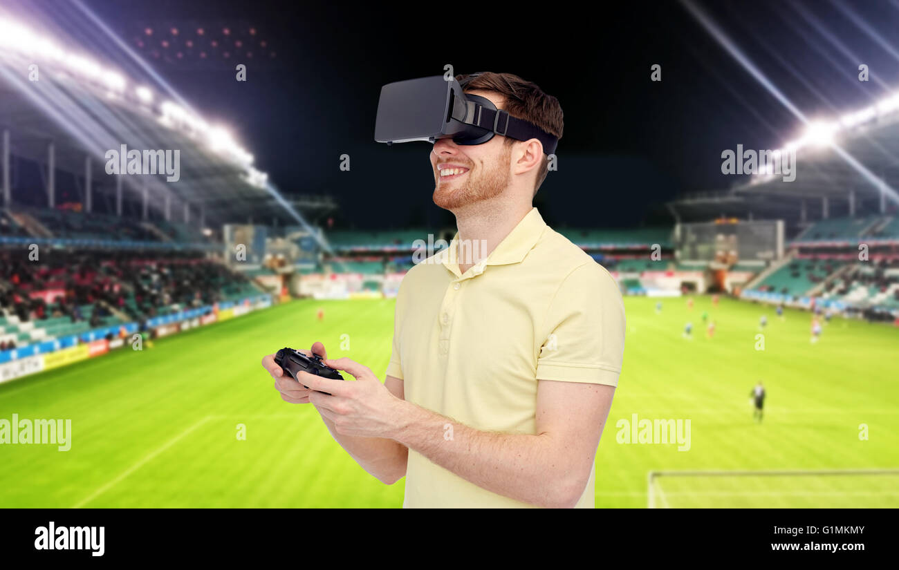 man in virtual reality headset over football field Stock Photo - Alamy