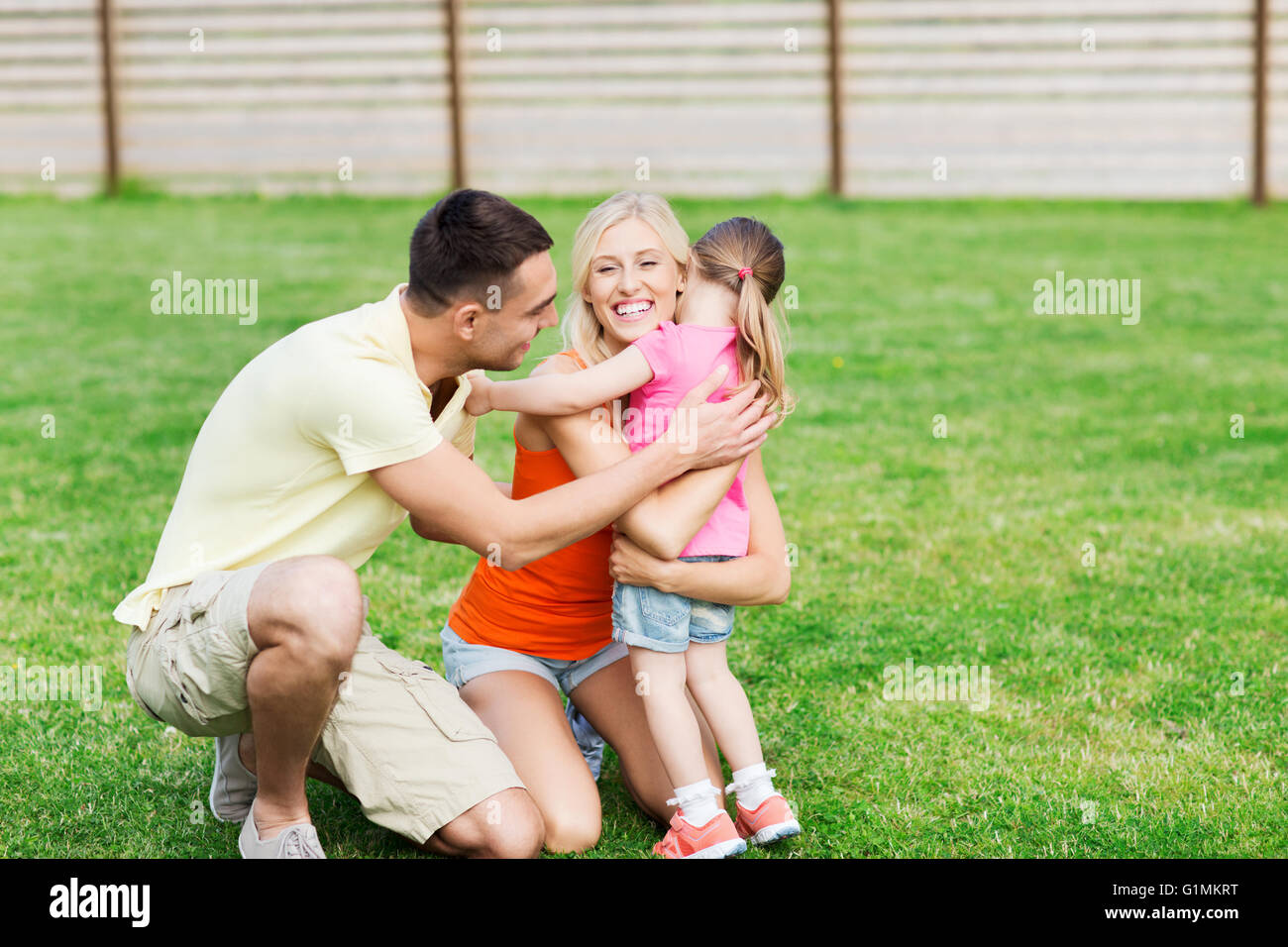 happy family hugging outdoors Stock Photo - Alamy