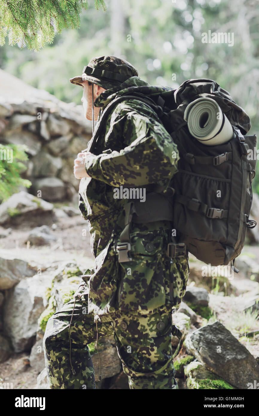 young soldier with backpack in forest Stock Photo - Alamy