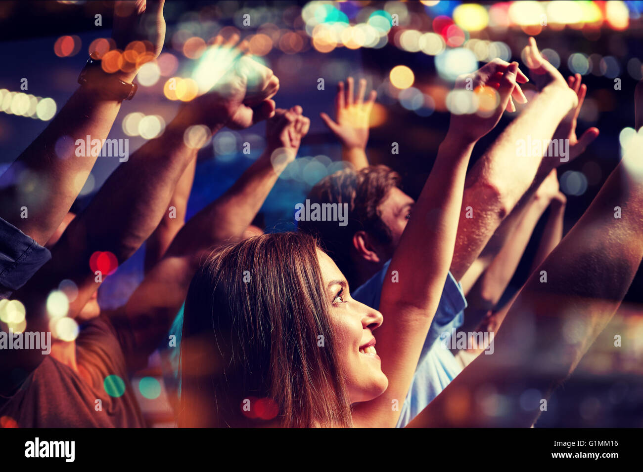 smiling friends at concert in club Stock Photo - Alamy