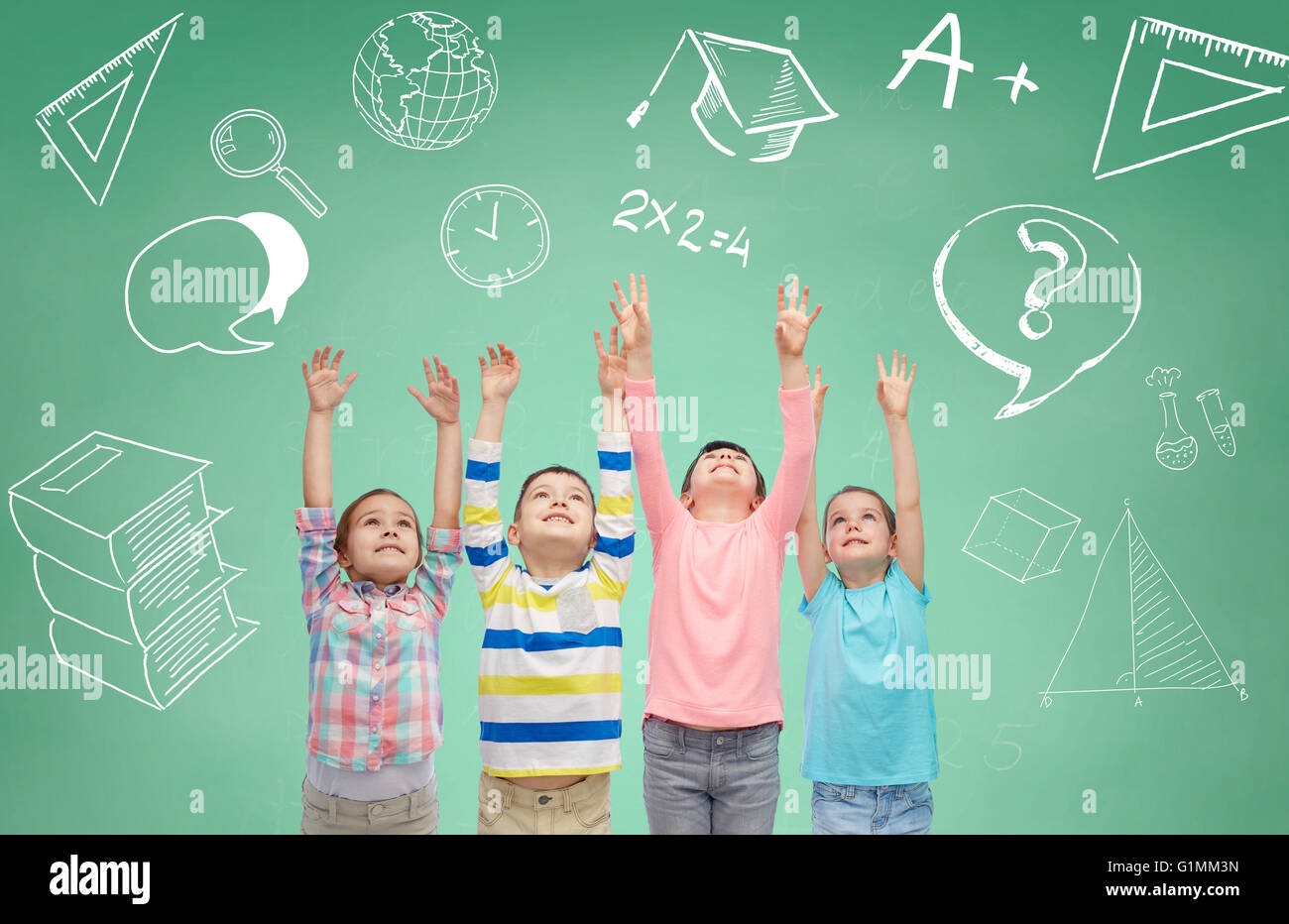 happy children raising hands over green blackboard Stock Photo - Alamy