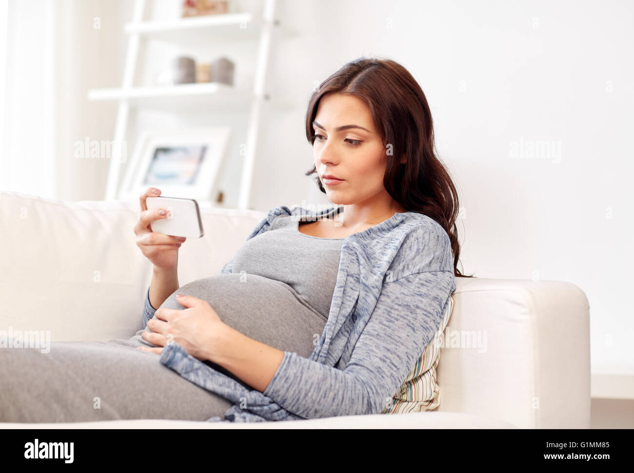 Sad pregnant woman hi-res stock photography and images - Alamy